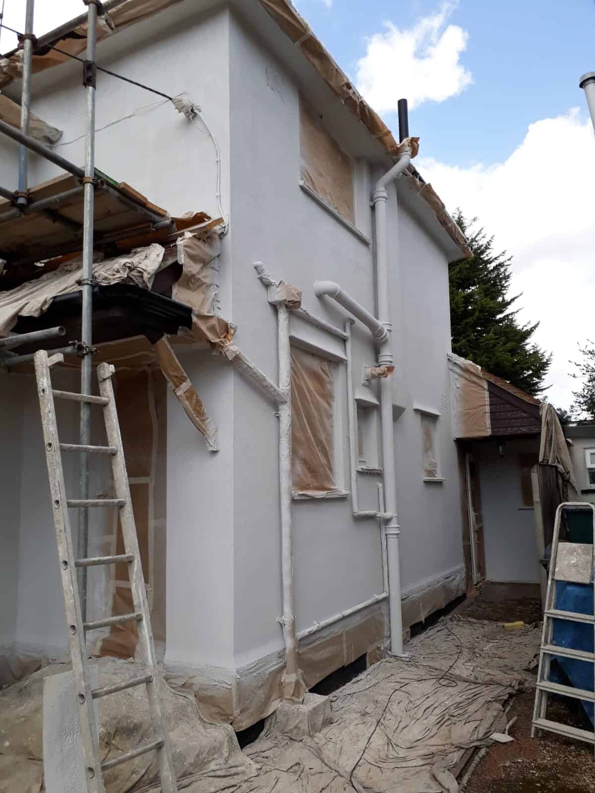 An example of applying an advanced textured wall coating for a house ...